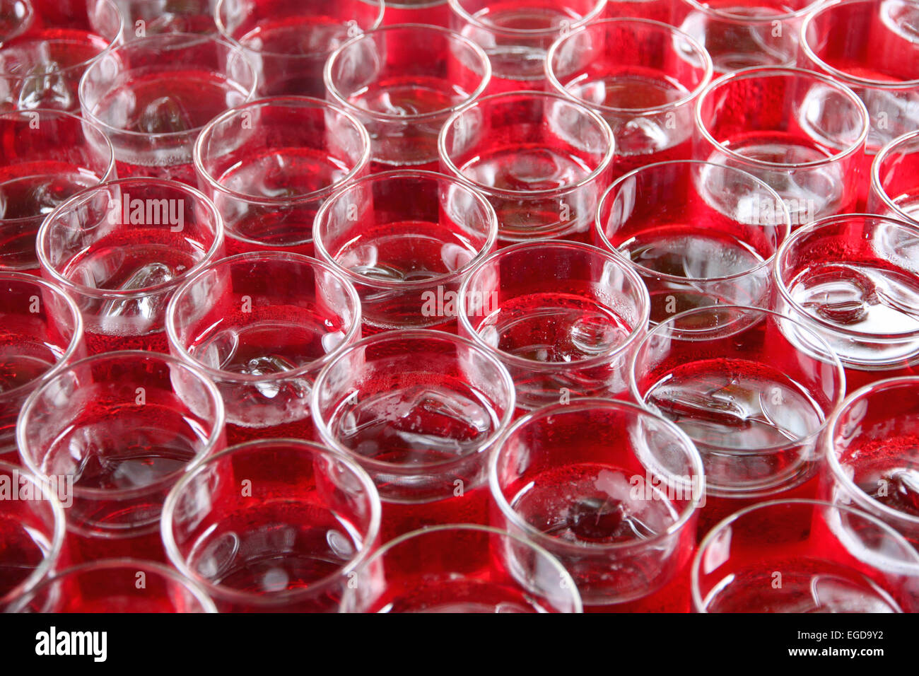 Red beverage in glass for drinks background Stock Photo - Alamy
