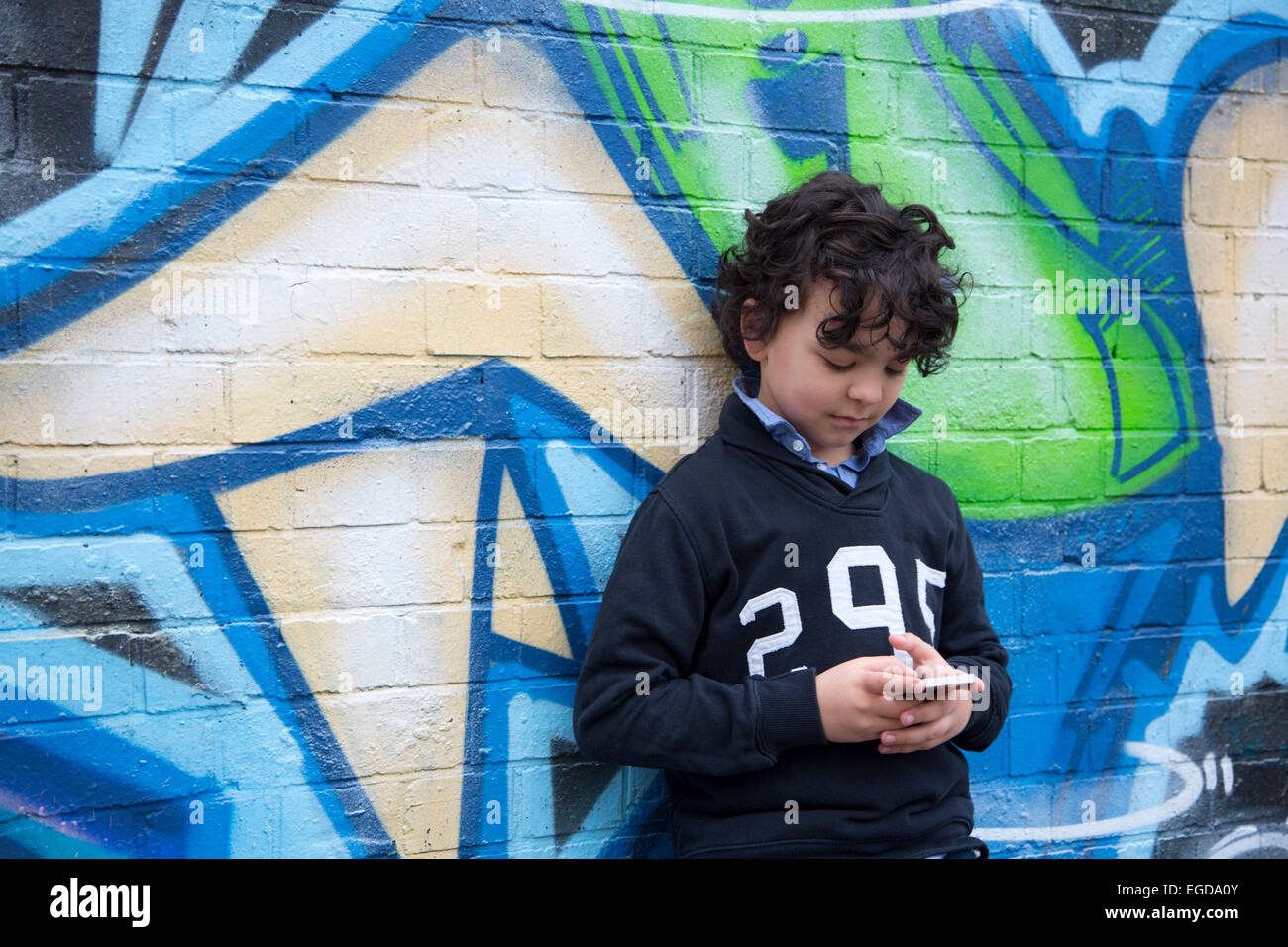 Boy texting iphone hi-res stock photography and images - Alamy