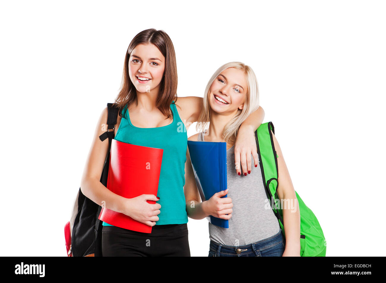 Two young happy students over white background Stock Photo - Alamy