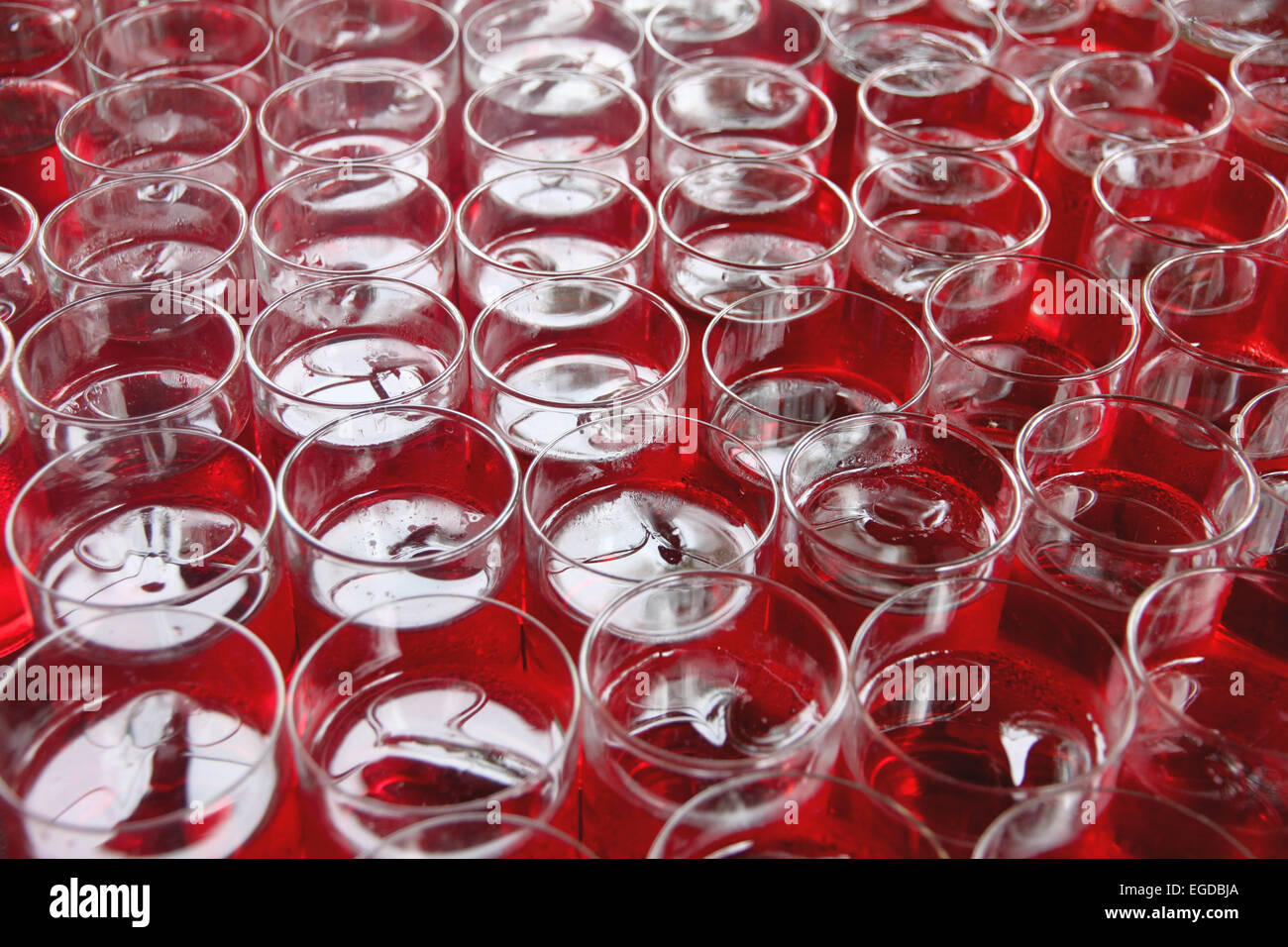 Red beverage in glass for drinks background Stock Photo - Alamy