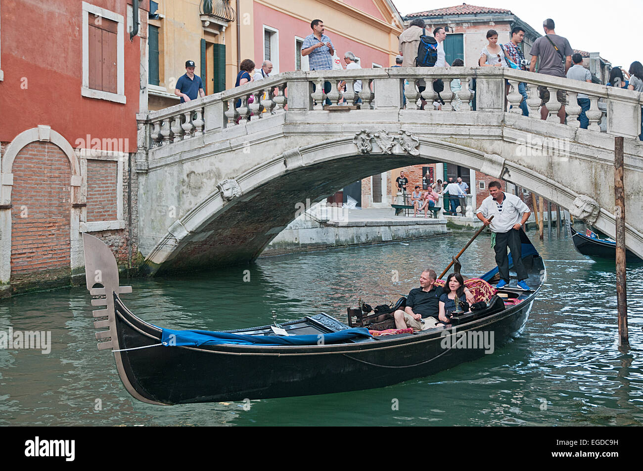 Young caucasian couple on gondola on Rio de Palazzo de Canonica Venice ...