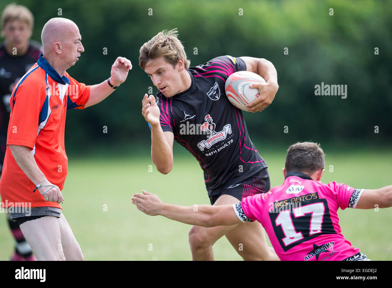 Rugby player running with ball Stock Photo - Alamy