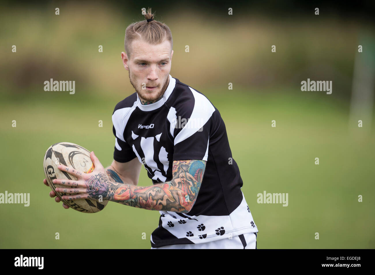 Rugby player running with ball Stock Photo - Alamy