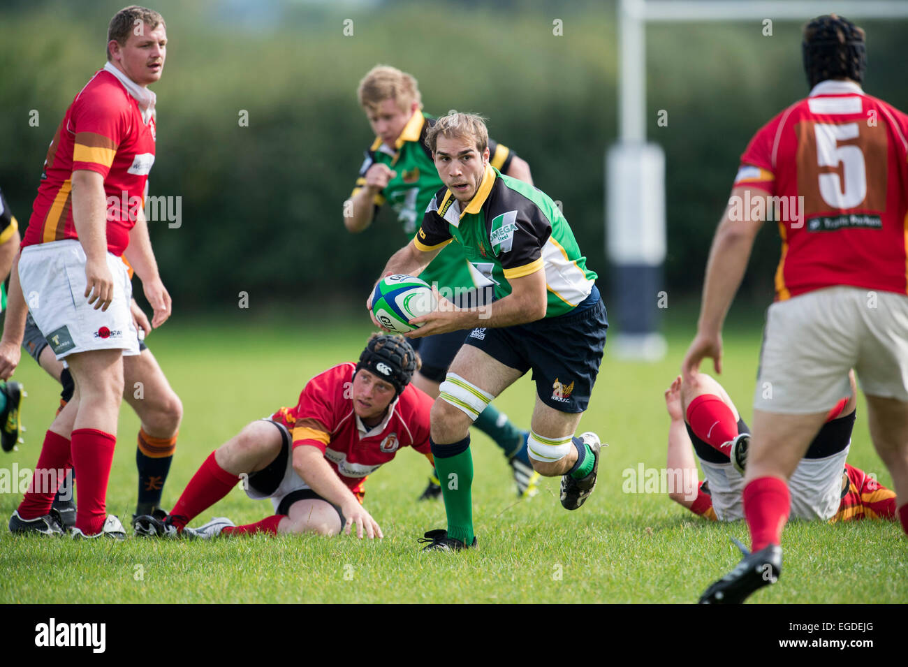Rugby player running with ball Stock Photo - Alamy