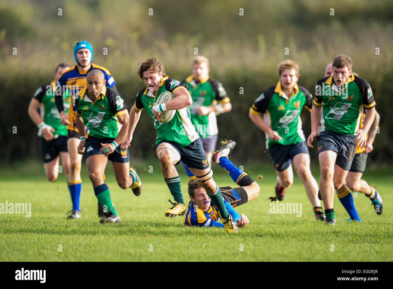 Rugby player running with ball Stock Photo - Alamy