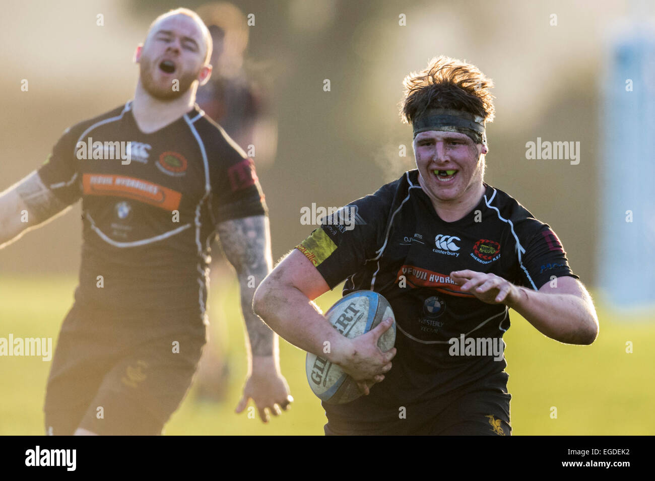 Rugby player running with ball Stock Photo - Alamy