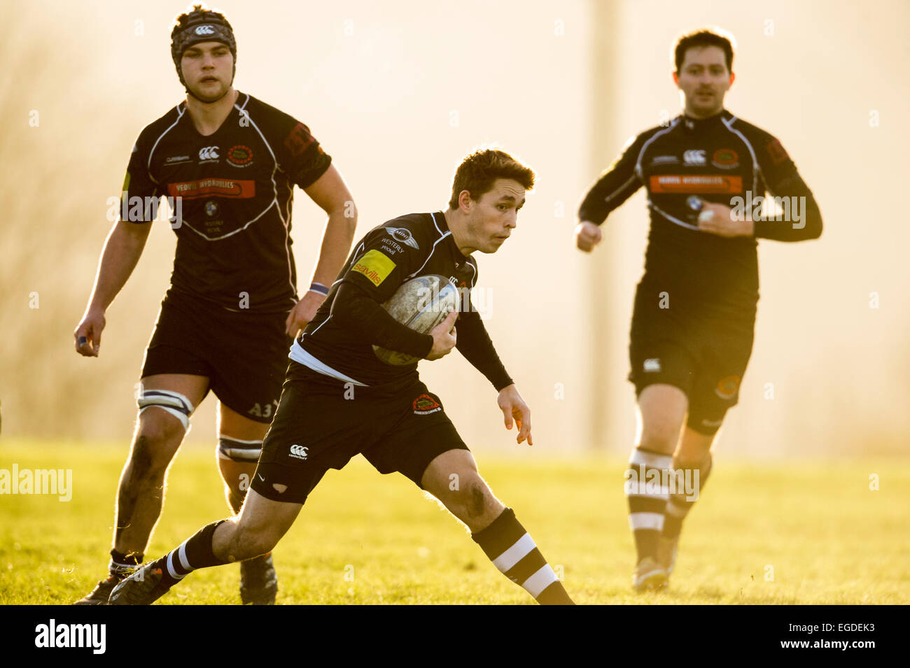 Rugby player running with ball Stock Photo - Alamy