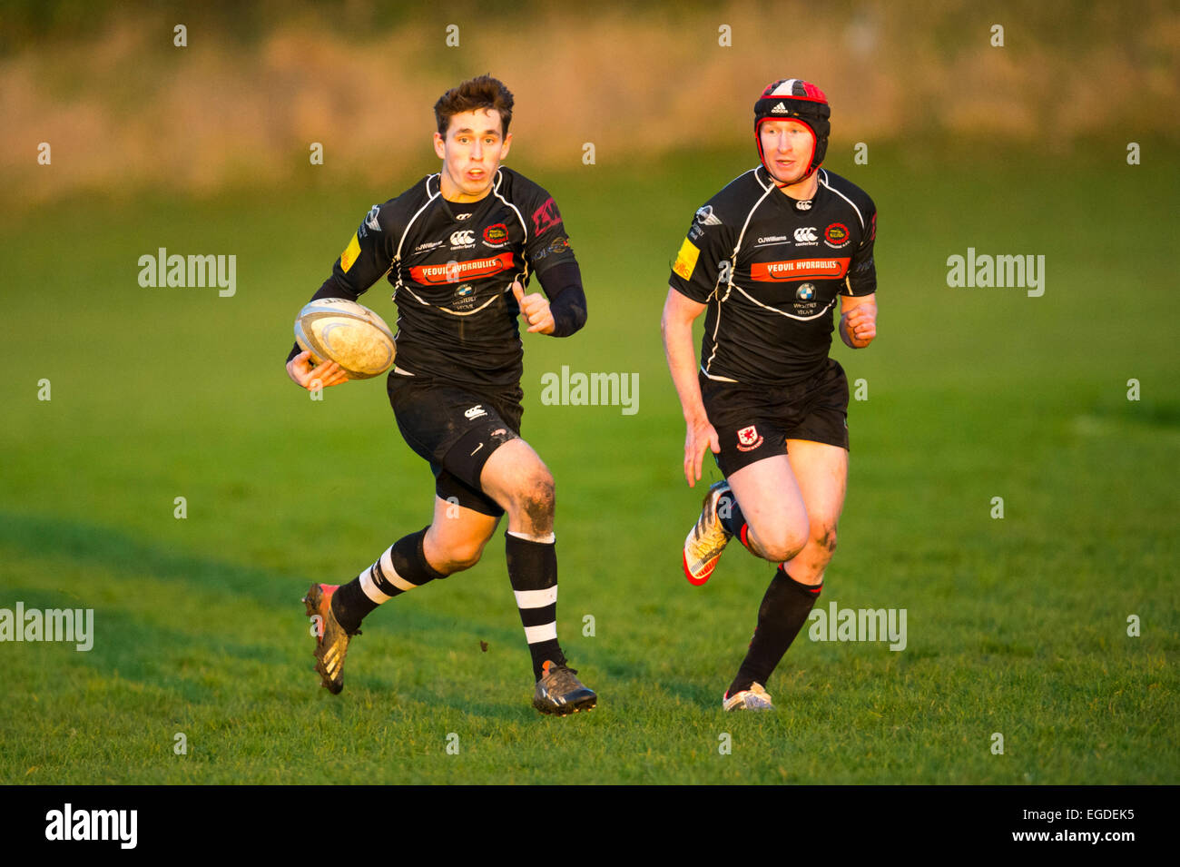Rugby player running with ball Stock Photo - Alamy