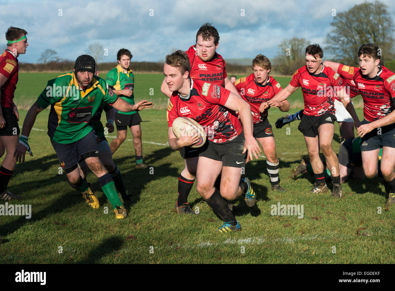Rugby player running with ball Stock Photo - Alamy