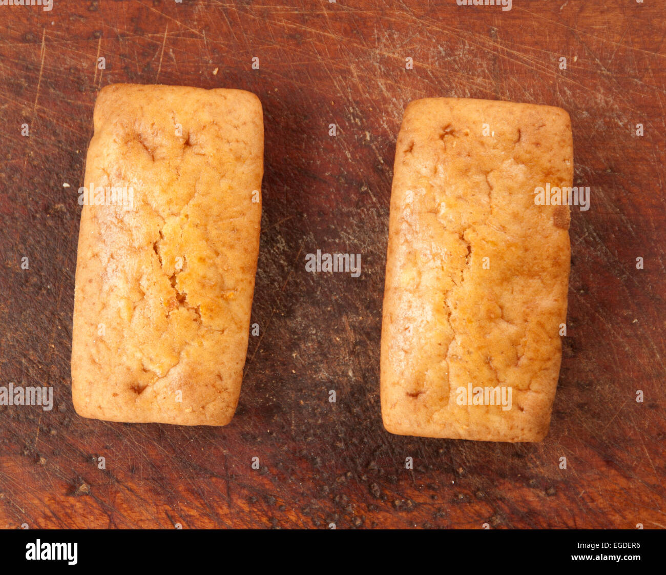Two cakes on a timber board, closeup Stock Photo - Alamy