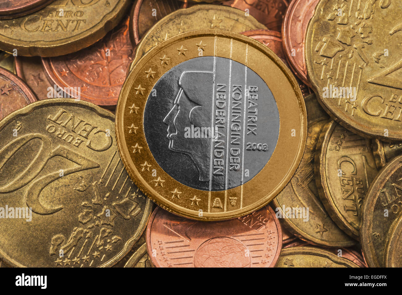 Many Euro coins, on top is a 1 Euro coin from the Netherlands Stock ...