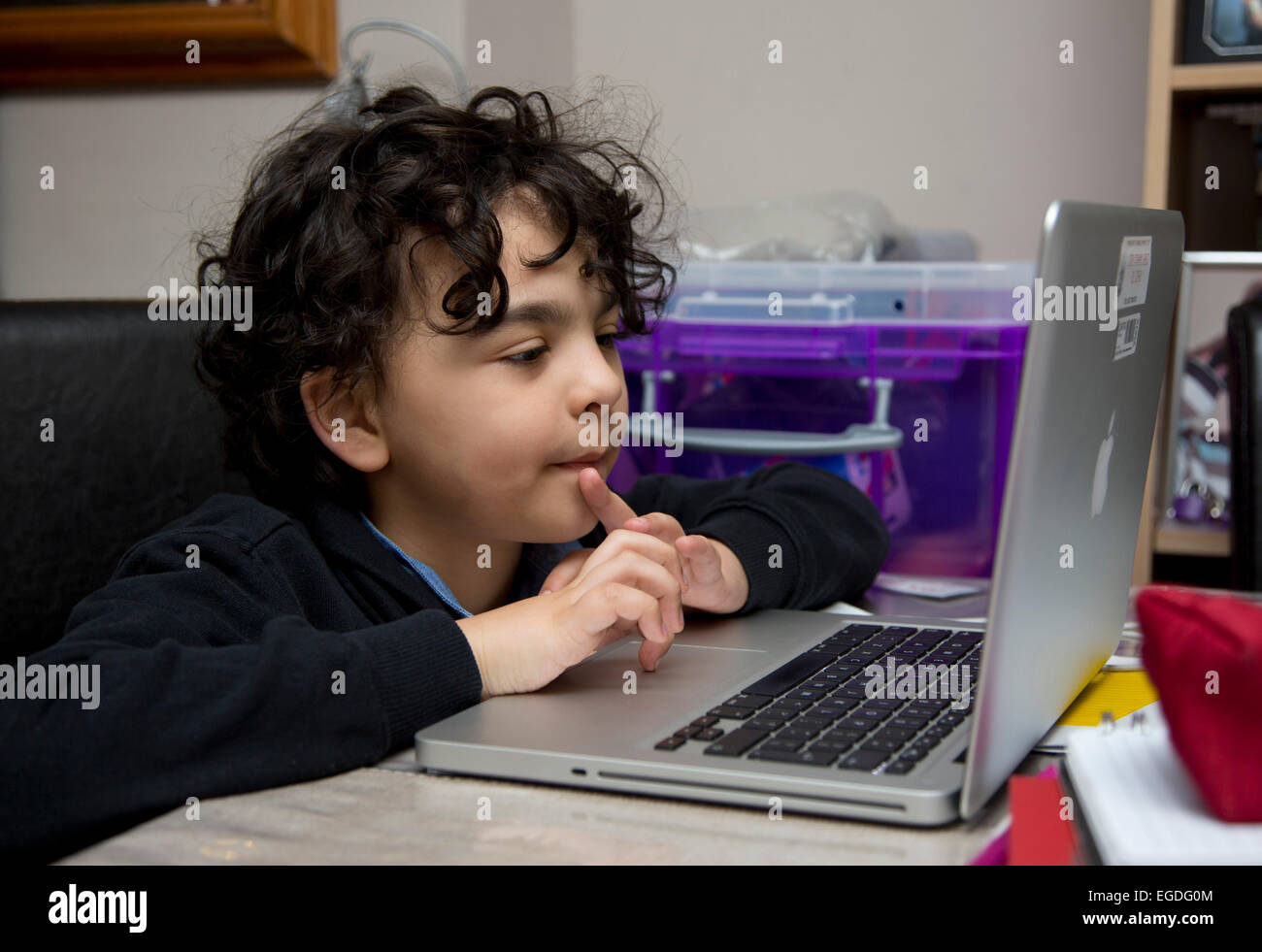 Child using a laptop Stock Photo - Alamy