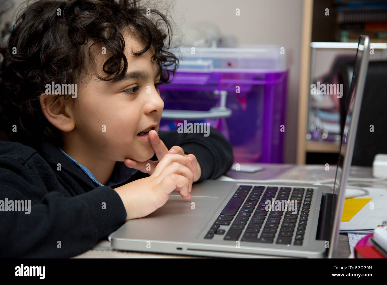 Child using a laptop Stock Photo - Alamy
