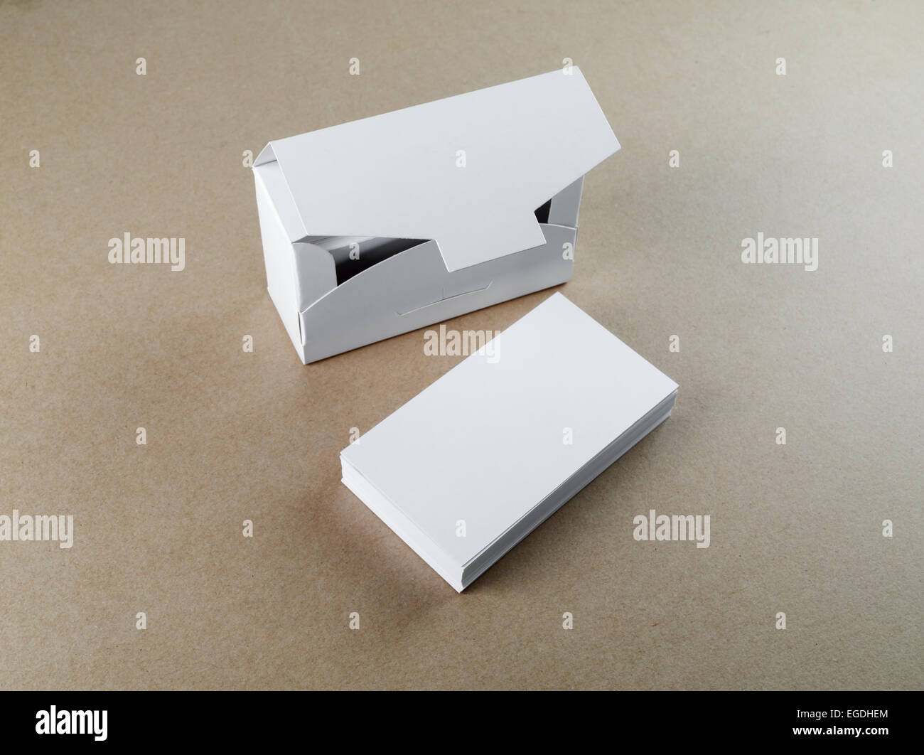Blank business cards and a box for them on the table. Template for ...