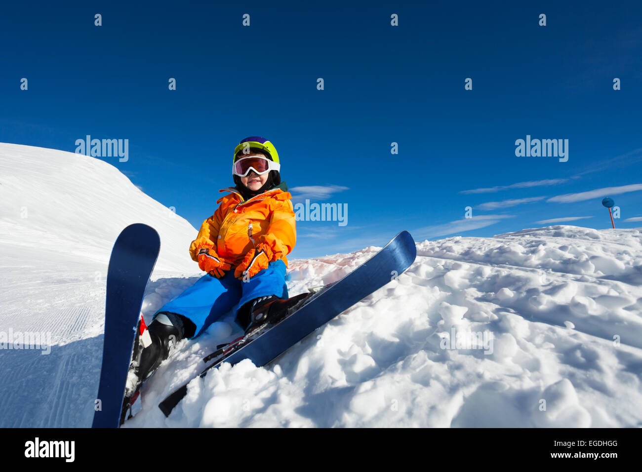 Smiling boy wearing ski mask and helmet on snow Stock Photo - Alamy