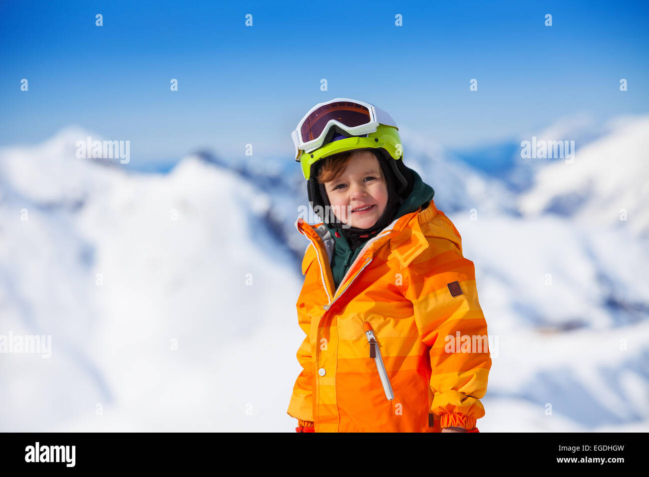 Portrait of smiling boy with ski mask and helmet Stock Photo - Alamy
