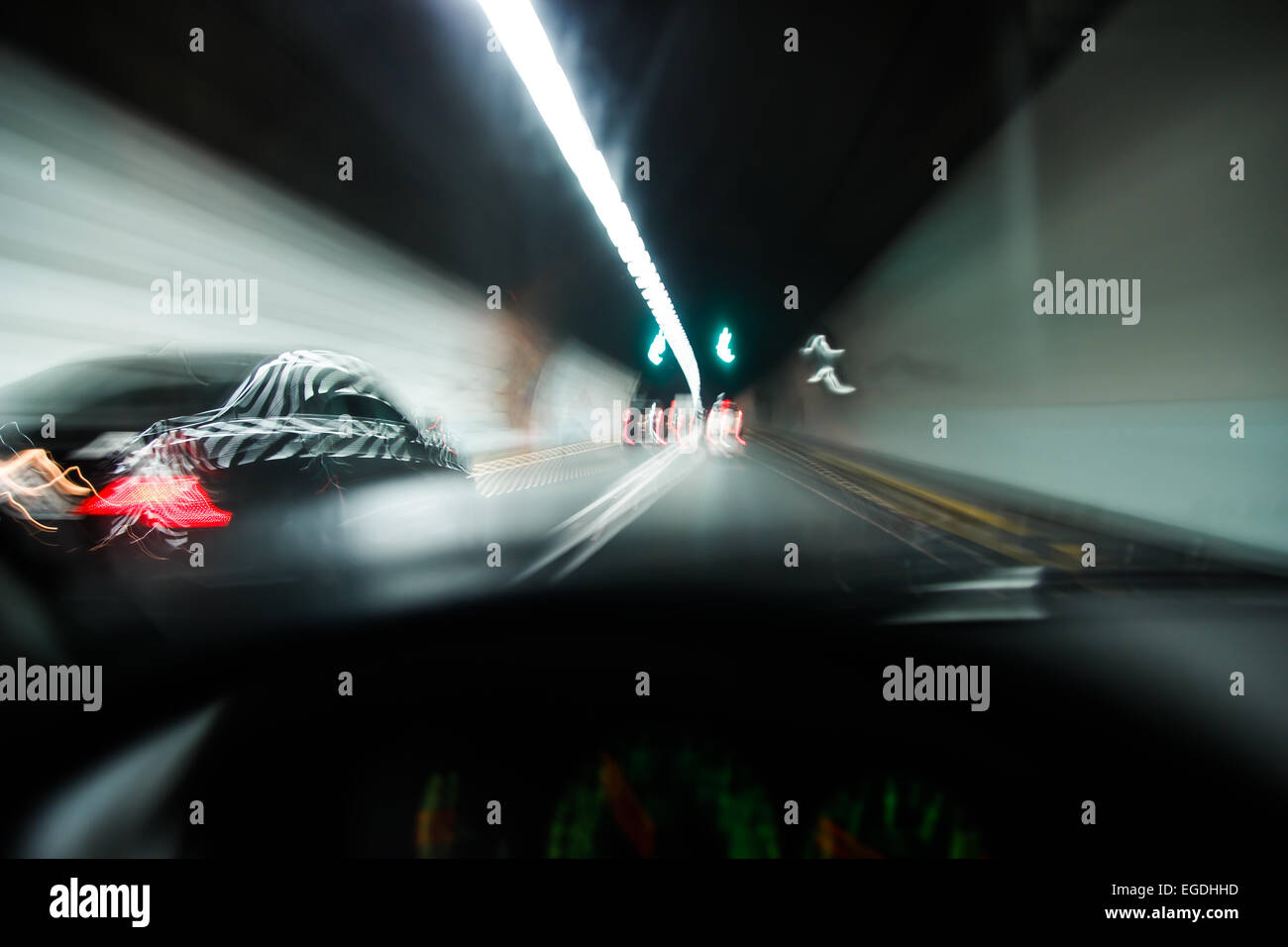 speeding car driving Stock Photo - Alamy