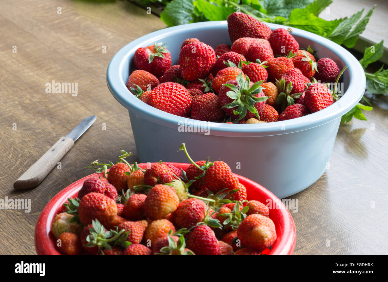 Strawberry jam cooking preparation of strawberries Stock Photo - Alamy