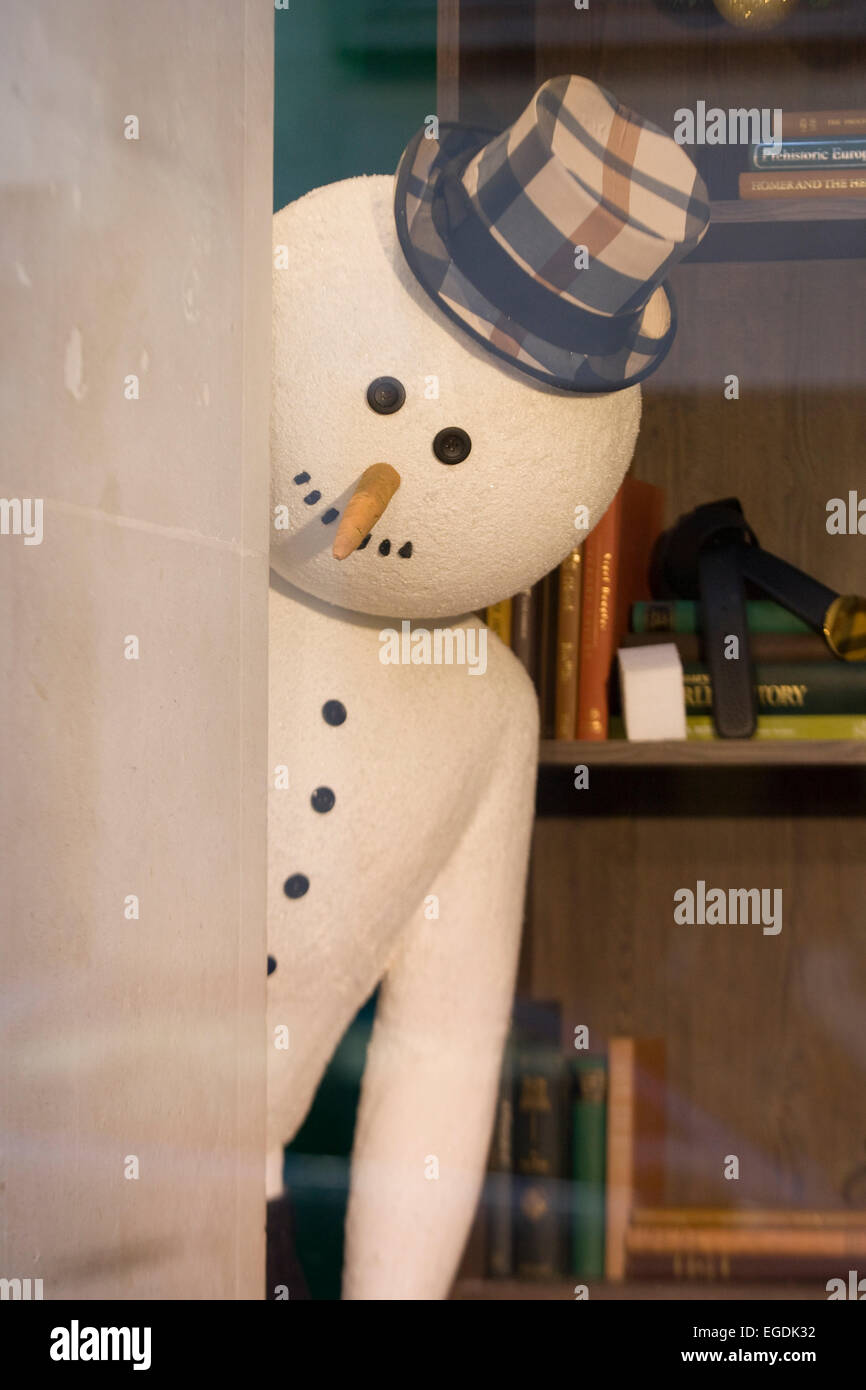 Shop Window display Snowman in a Hat Peaking around A Post Stock Photo ...