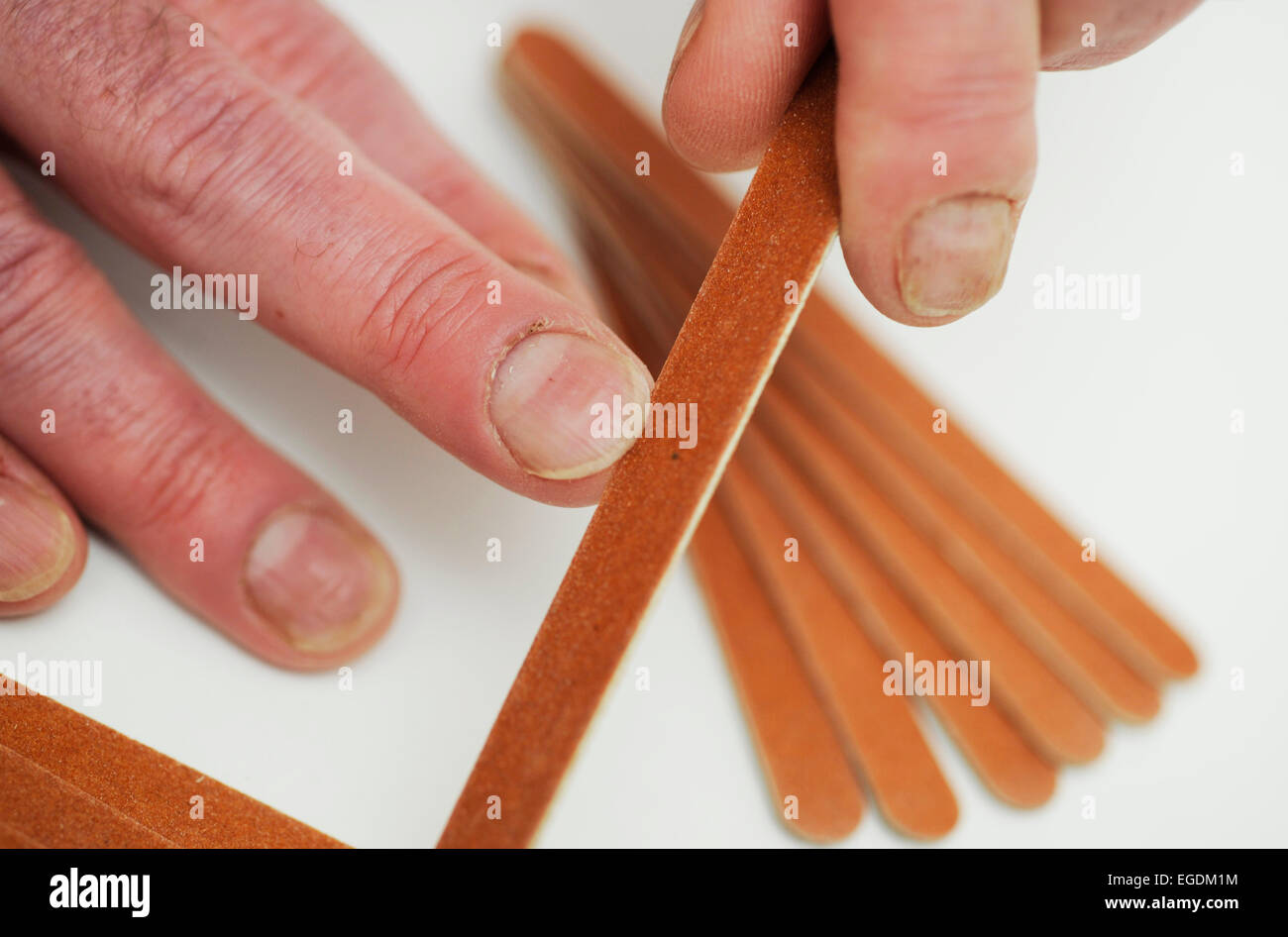 Man filing his nails Stock Photo - Alamy