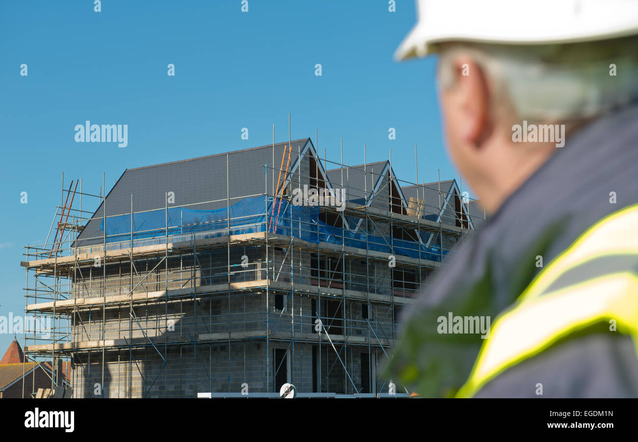 Civil engineer looking towards newly built residential homes Stock ...