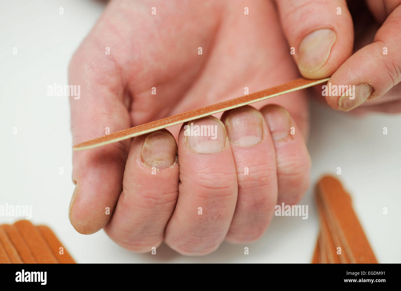 Man filing his nails Stock Photo - Alamy