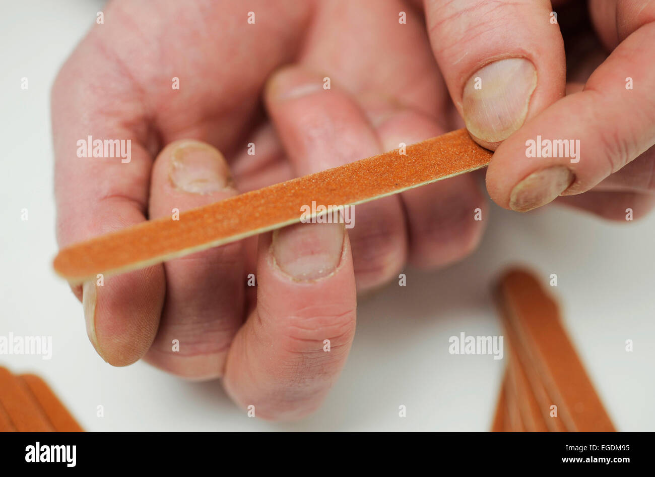Man filing his nails Stock Photo - Alamy