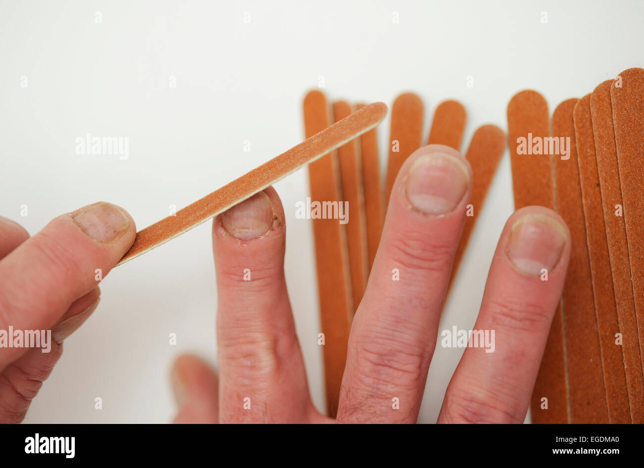 Man filing his nails Stock Photo - Alamy