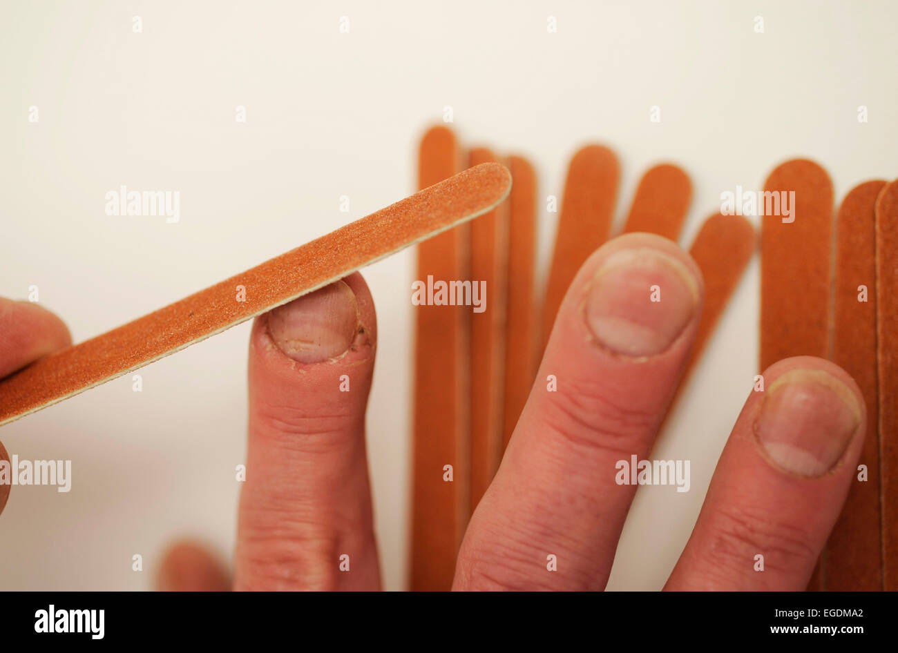 Man filing his nails Stock Photo - Alamy