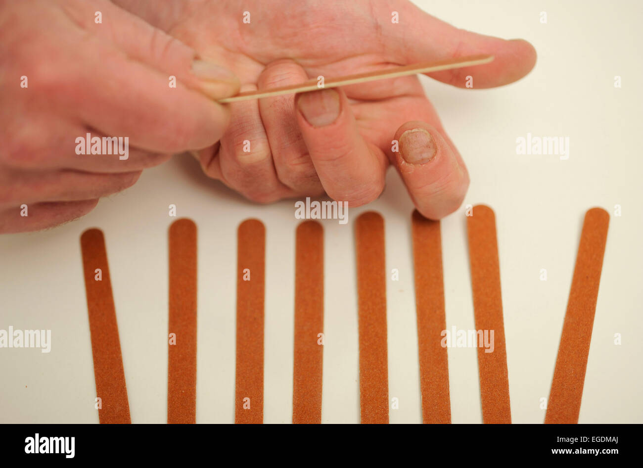 Man filing his nails Stock Photo - Alamy