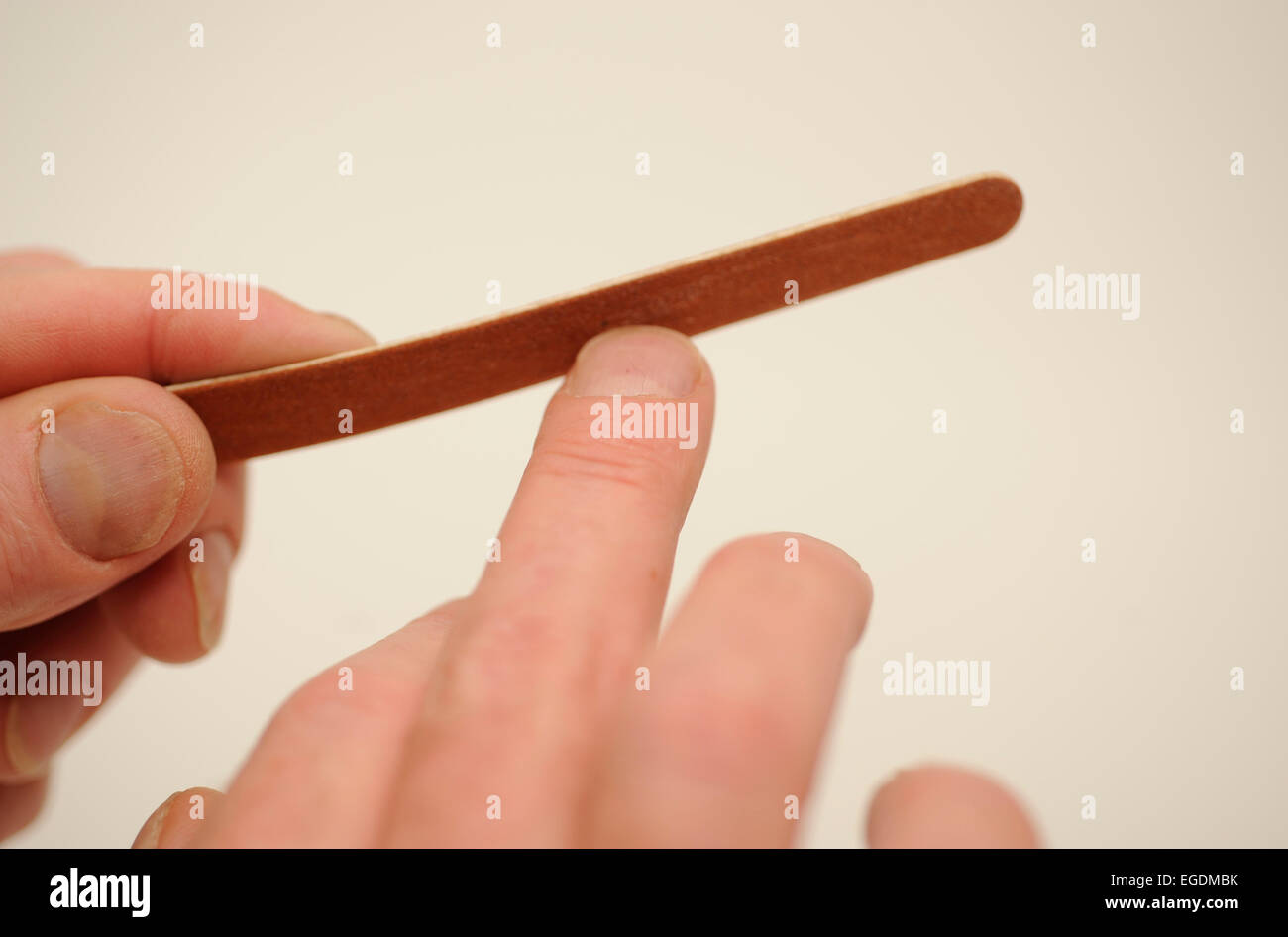 Man filing his nails Stock Photo - Alamy