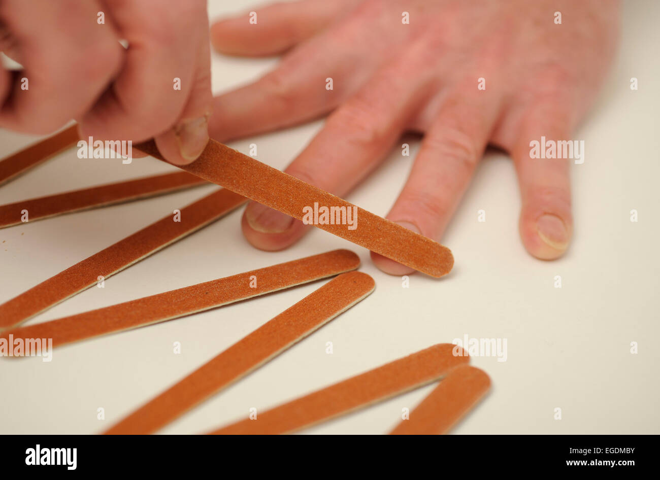 Manicuring finger nails hi-res stock photography and images - Alamy