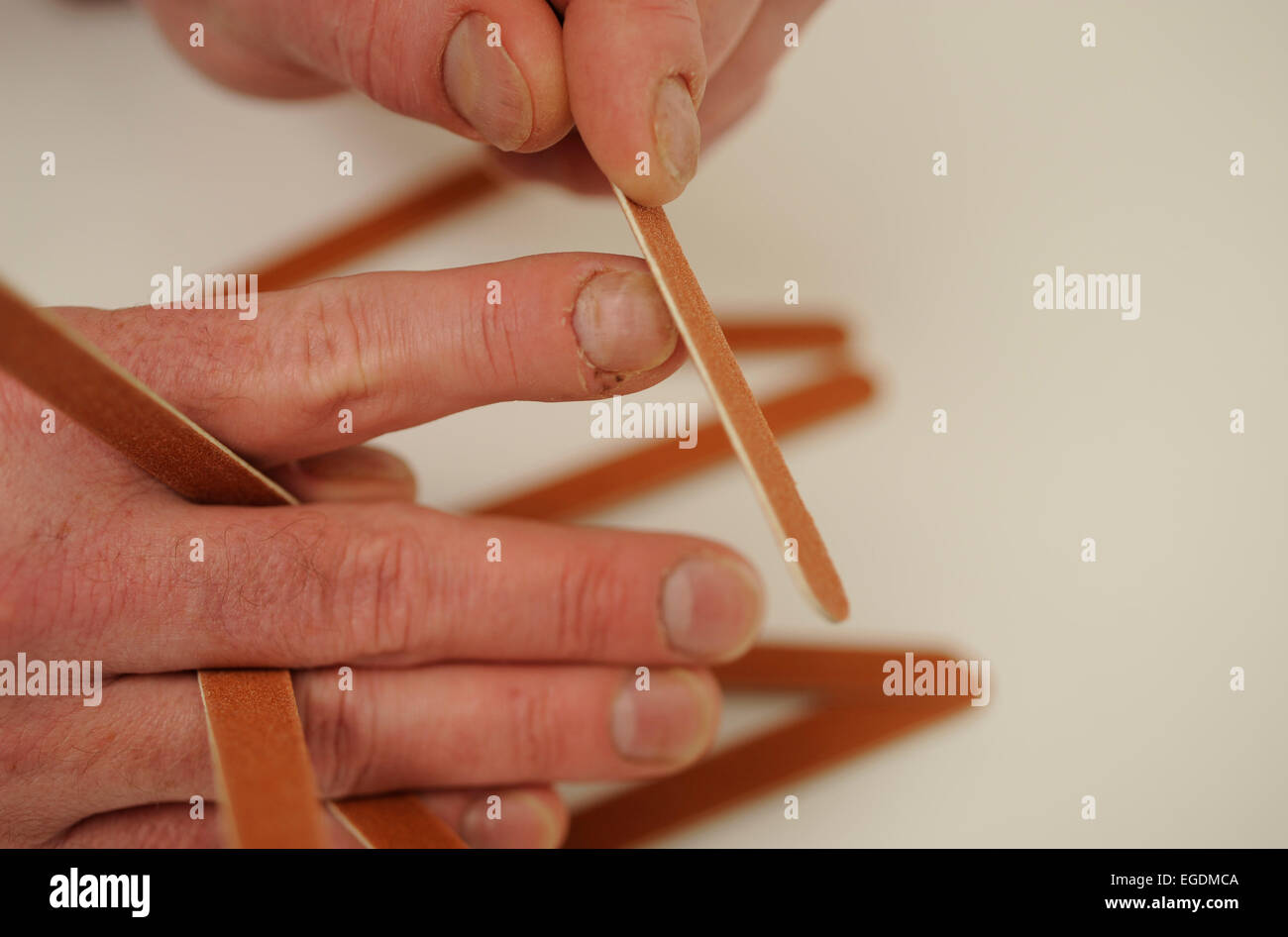 Man filing his nails Stock Photo - Alamy