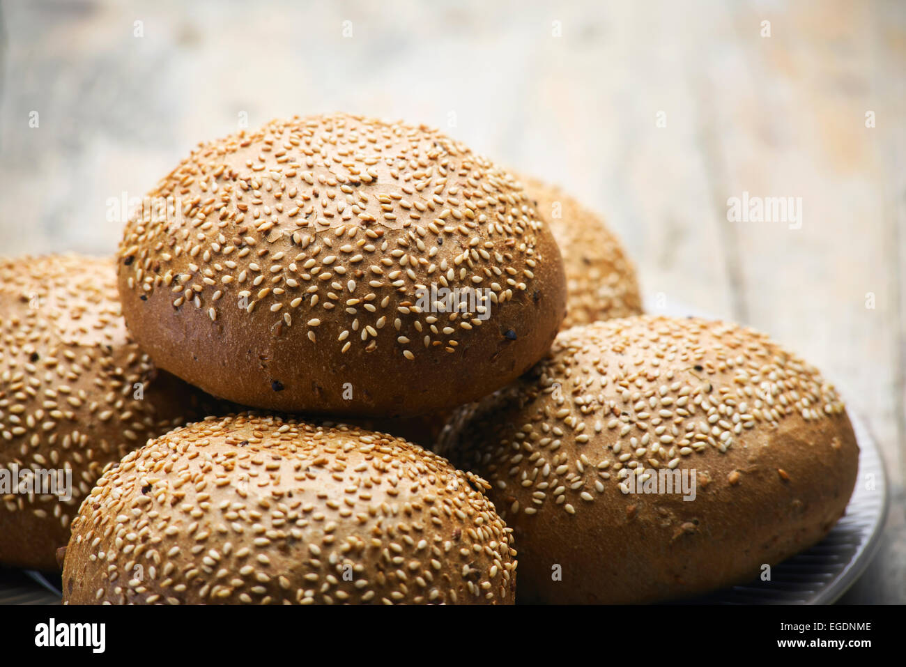 dark bun with sesame seeds Stock Photo - Alamy