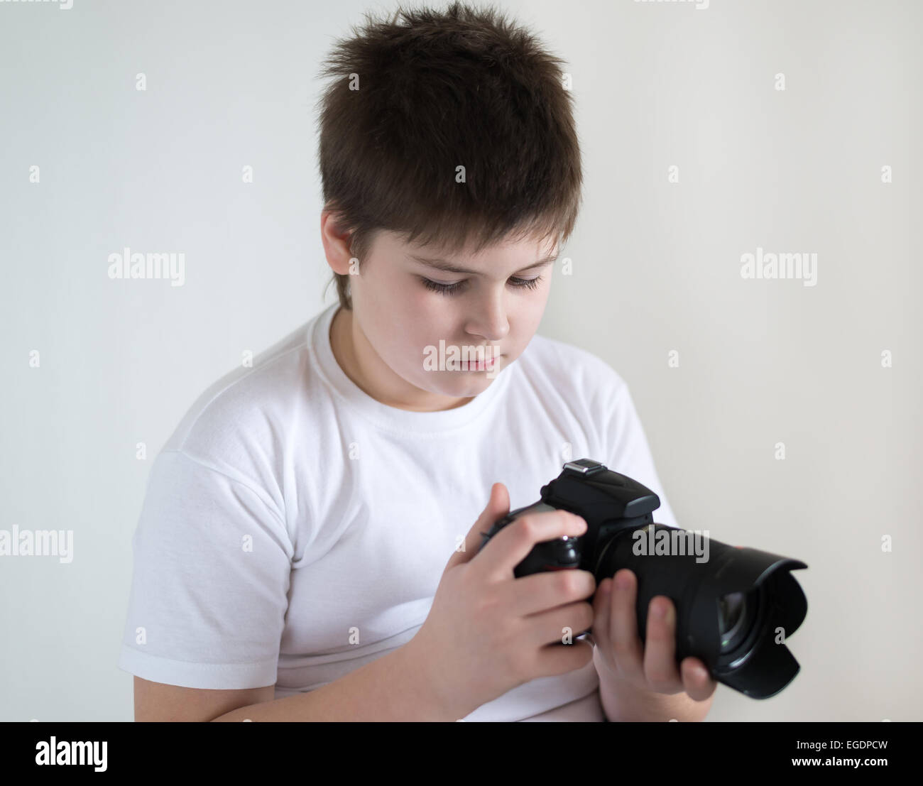 teenage boy with camera on light Stock Photo - Alamy