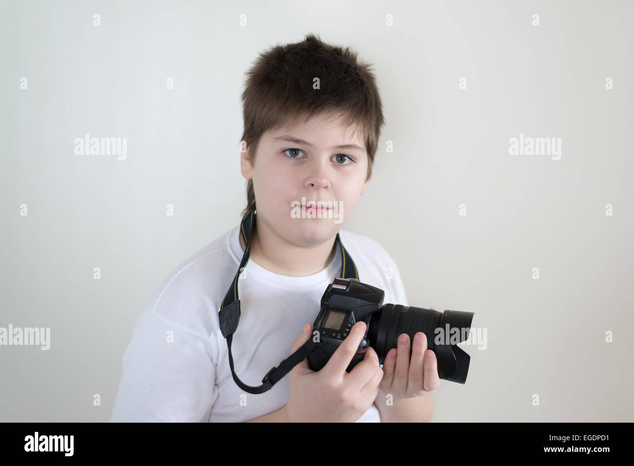 teenage boy with camera on light Stock Photo - Alamy