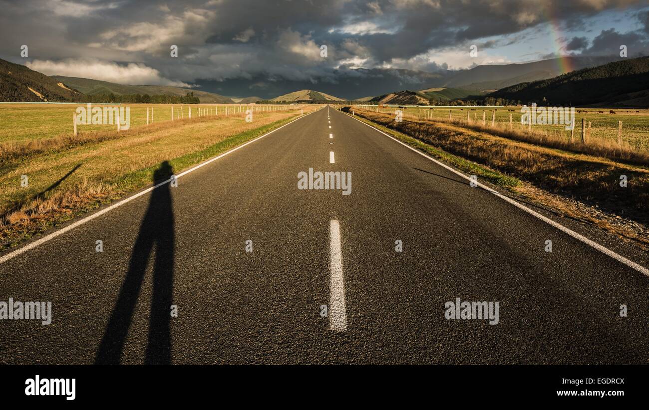 Long straight street covered by a rainbow in sunrise Stock Photo - Alamy