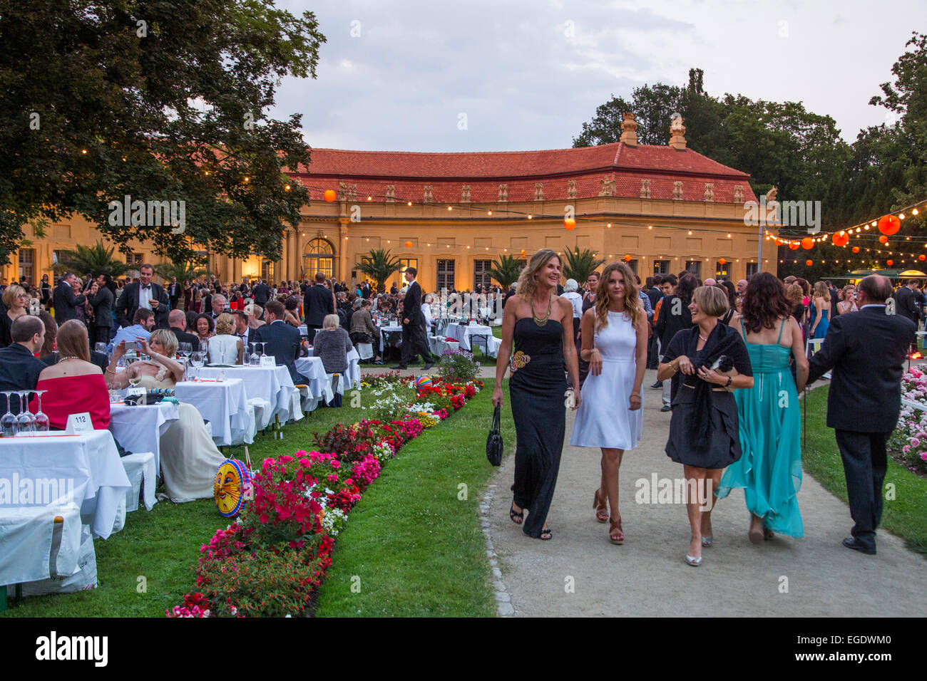 People enjoying the formal ball in the castle gardens, hosted by ...