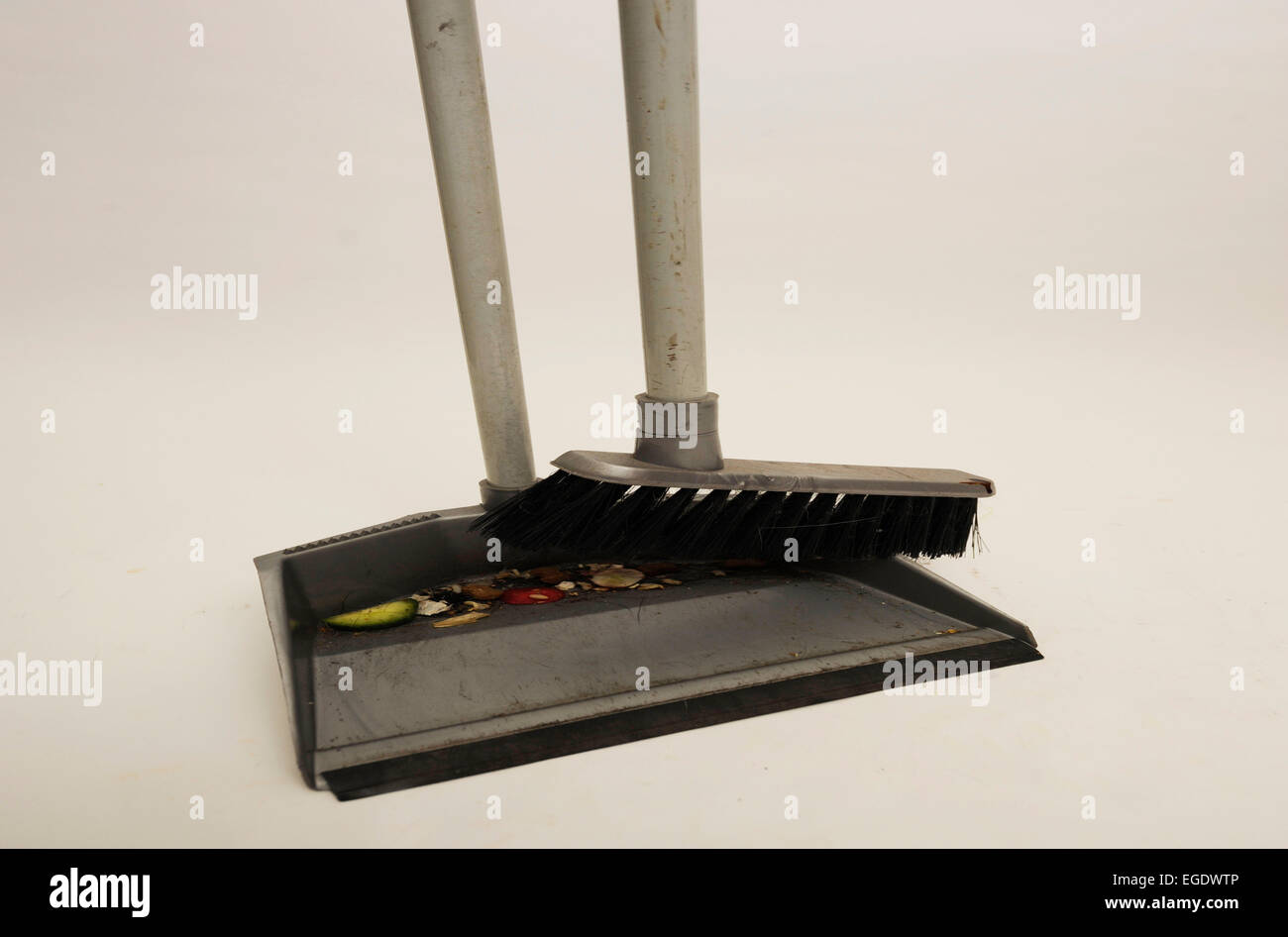 Sweeping dirt into dust pan hi-res stock photography and images - Alamy
