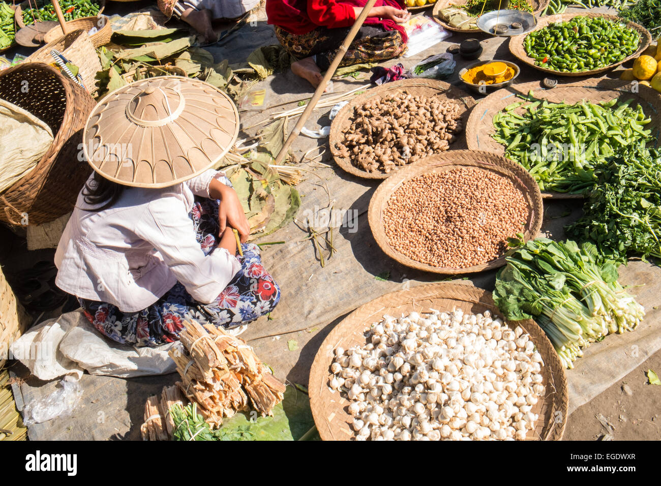 Locals at 5 Day Market, a rotating system,on banks of Inle Lake. Here ...