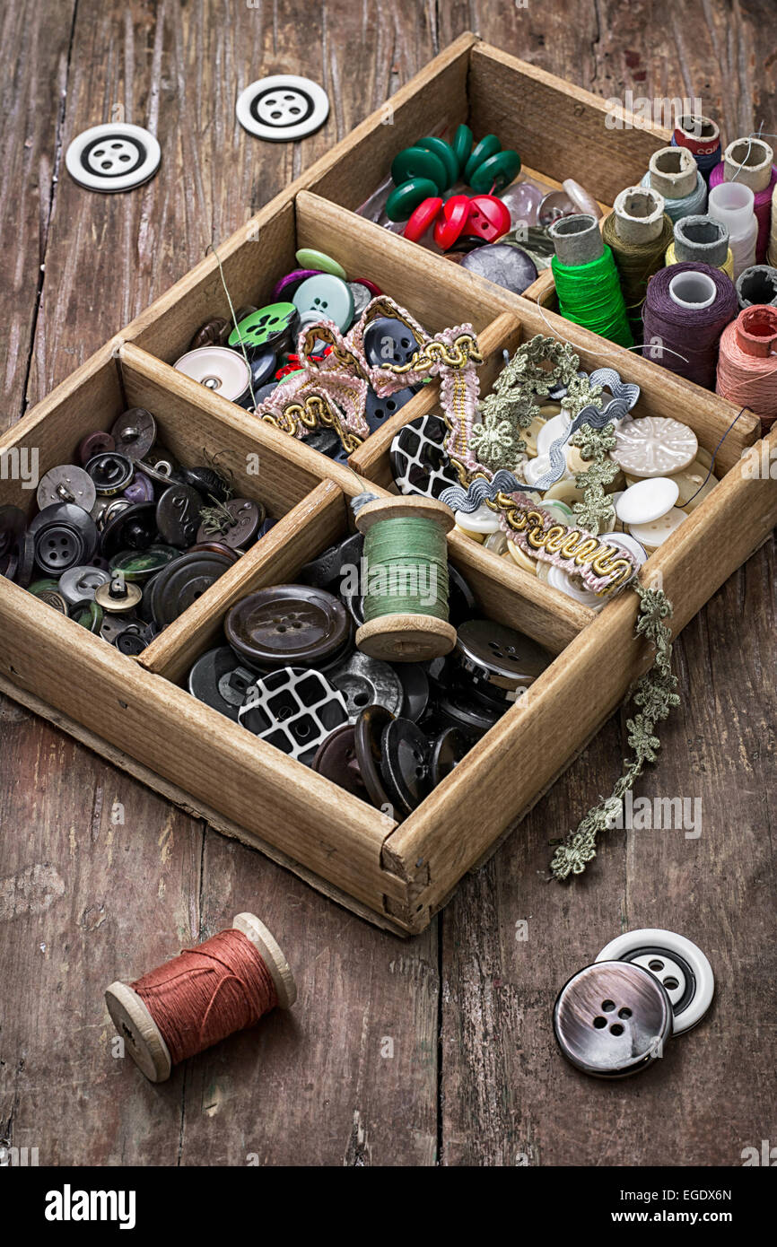 old wooden box with thread and buttons for needlework in vintage style ...