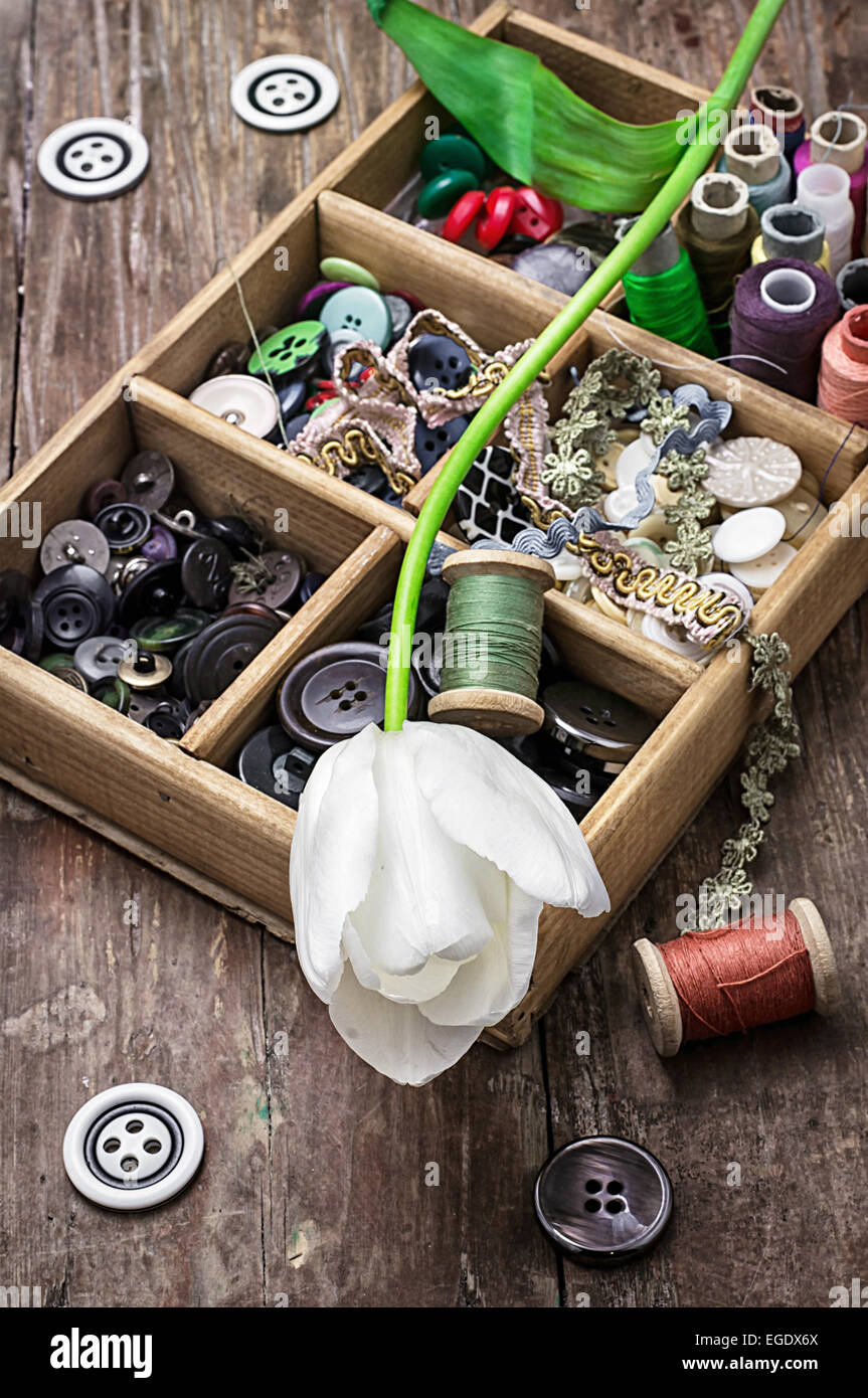 old wooden box with thread and buttons for needlework in vintage style ...