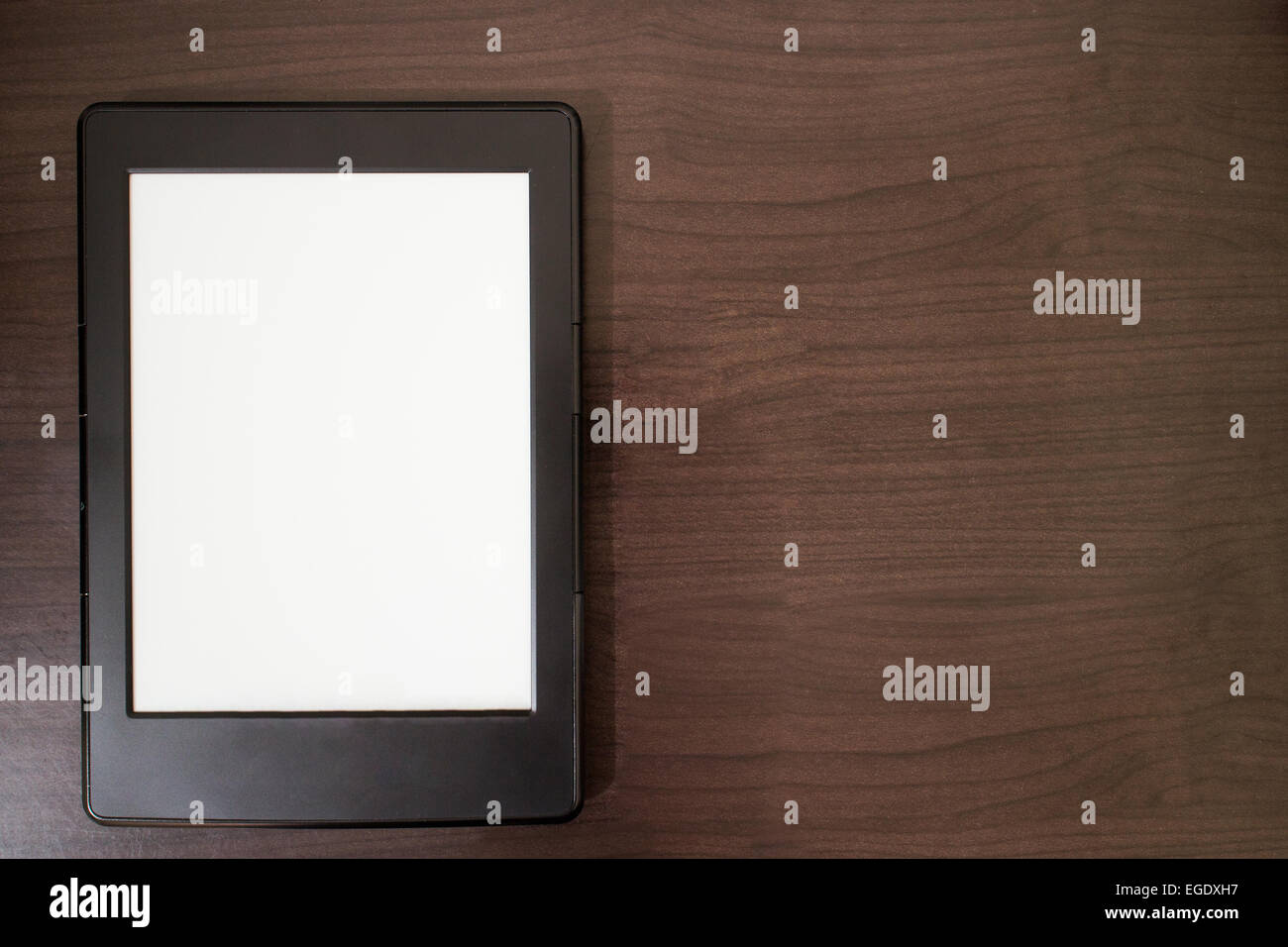 E-book reader on wooden table background with copy space Stock Photo ...