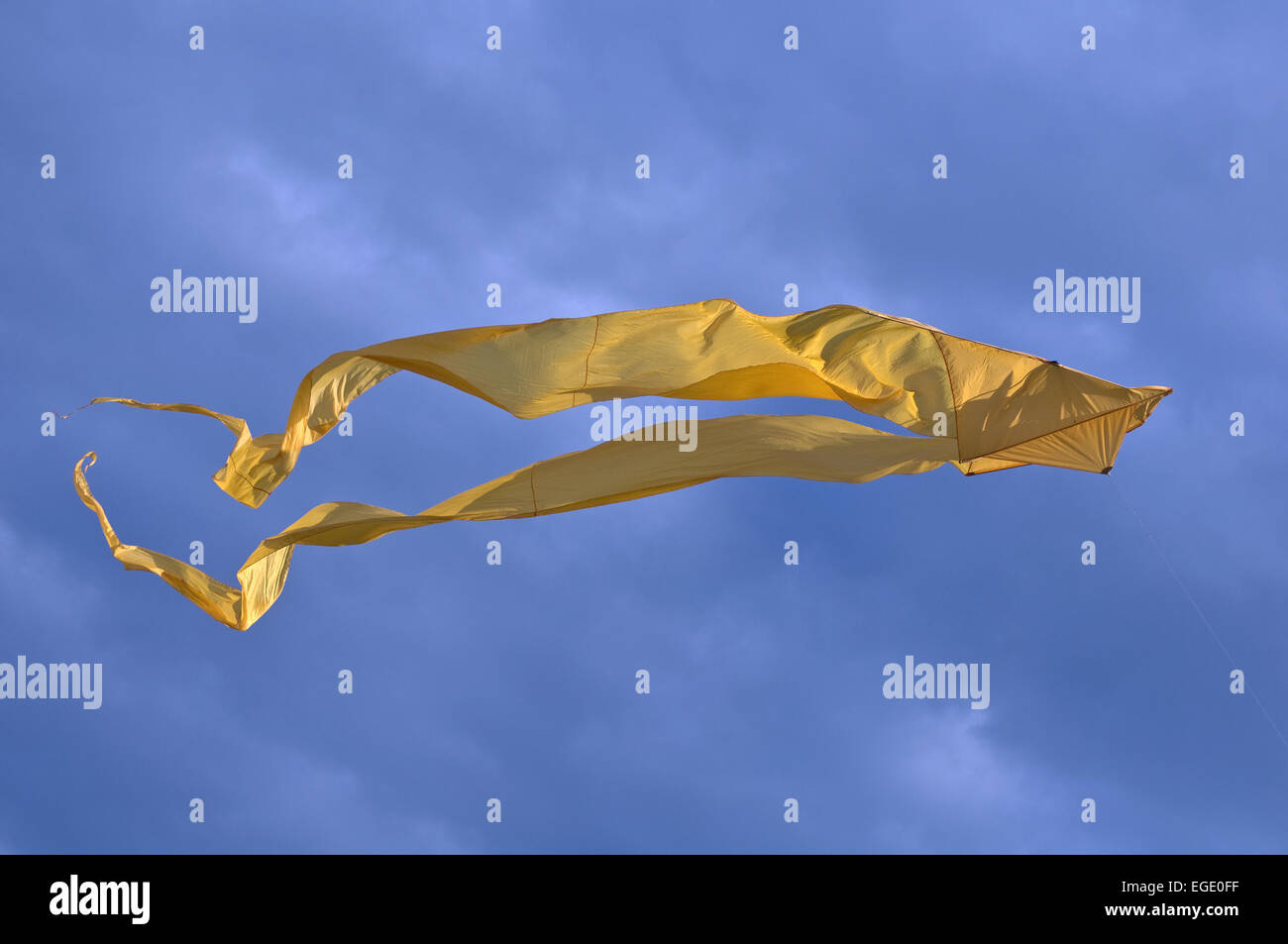 Yellow flying kite Stock Photo - Alamy