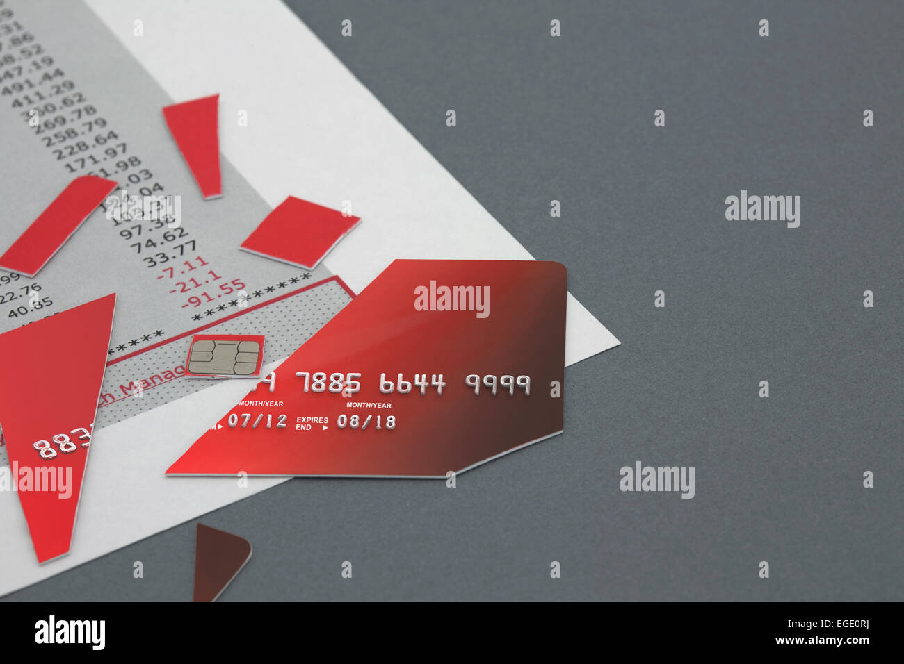 Cut up Credit Card on top of a Bank Statement Stock Photo - Alamy
