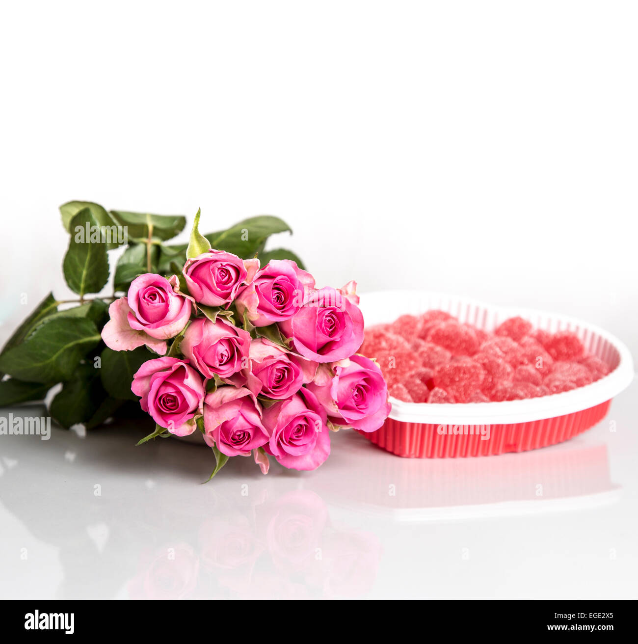 Pink Roses and Candy Hearts Stock Photo - Alamy