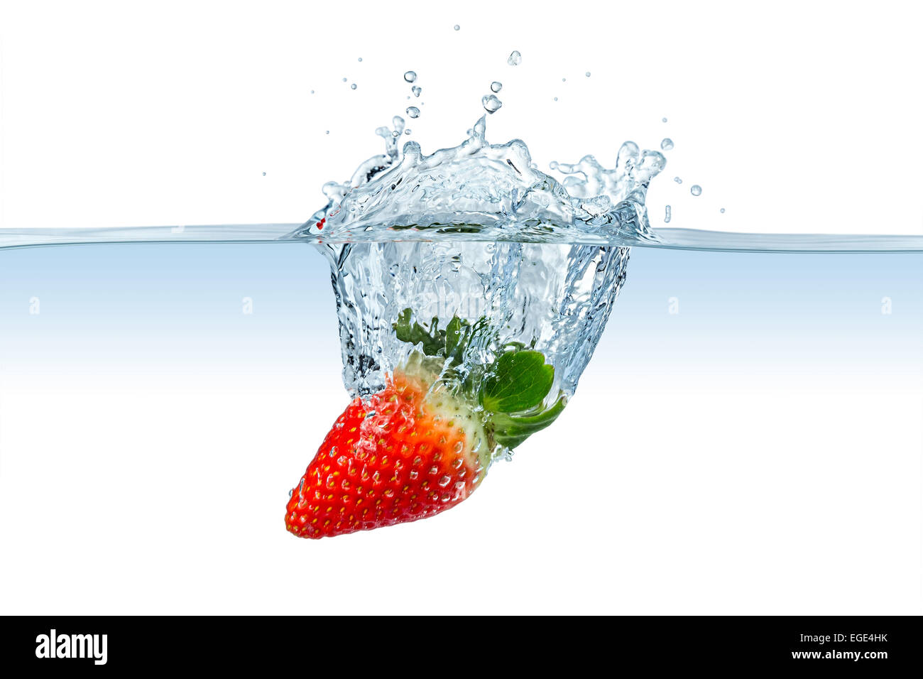 strawberry splashes into water Stock Photo - Alamy