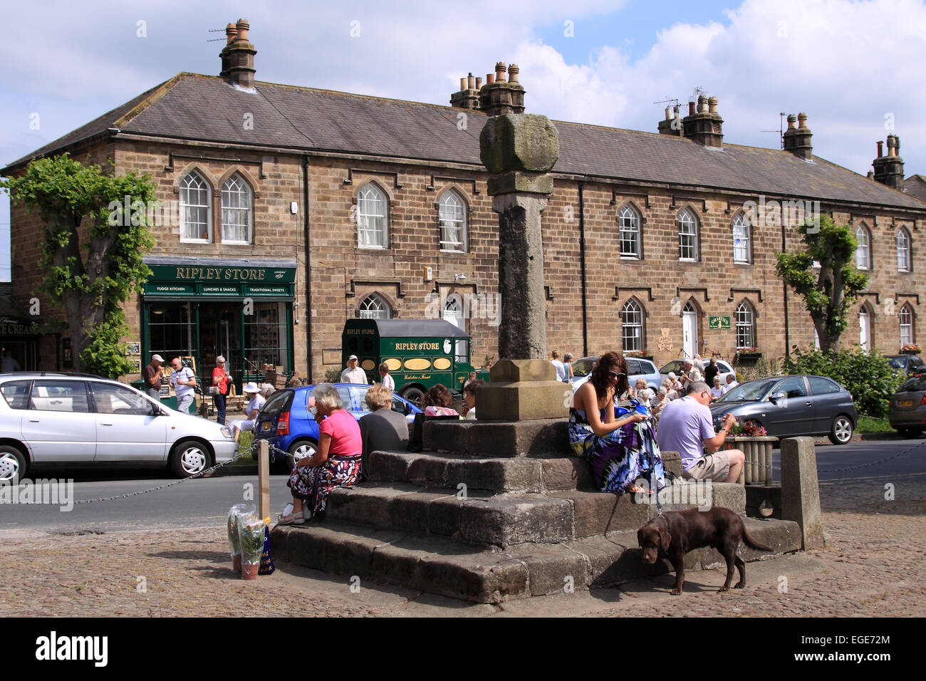 Spring sunshine in the village of Ripley with stone cross, Ripley Store ...