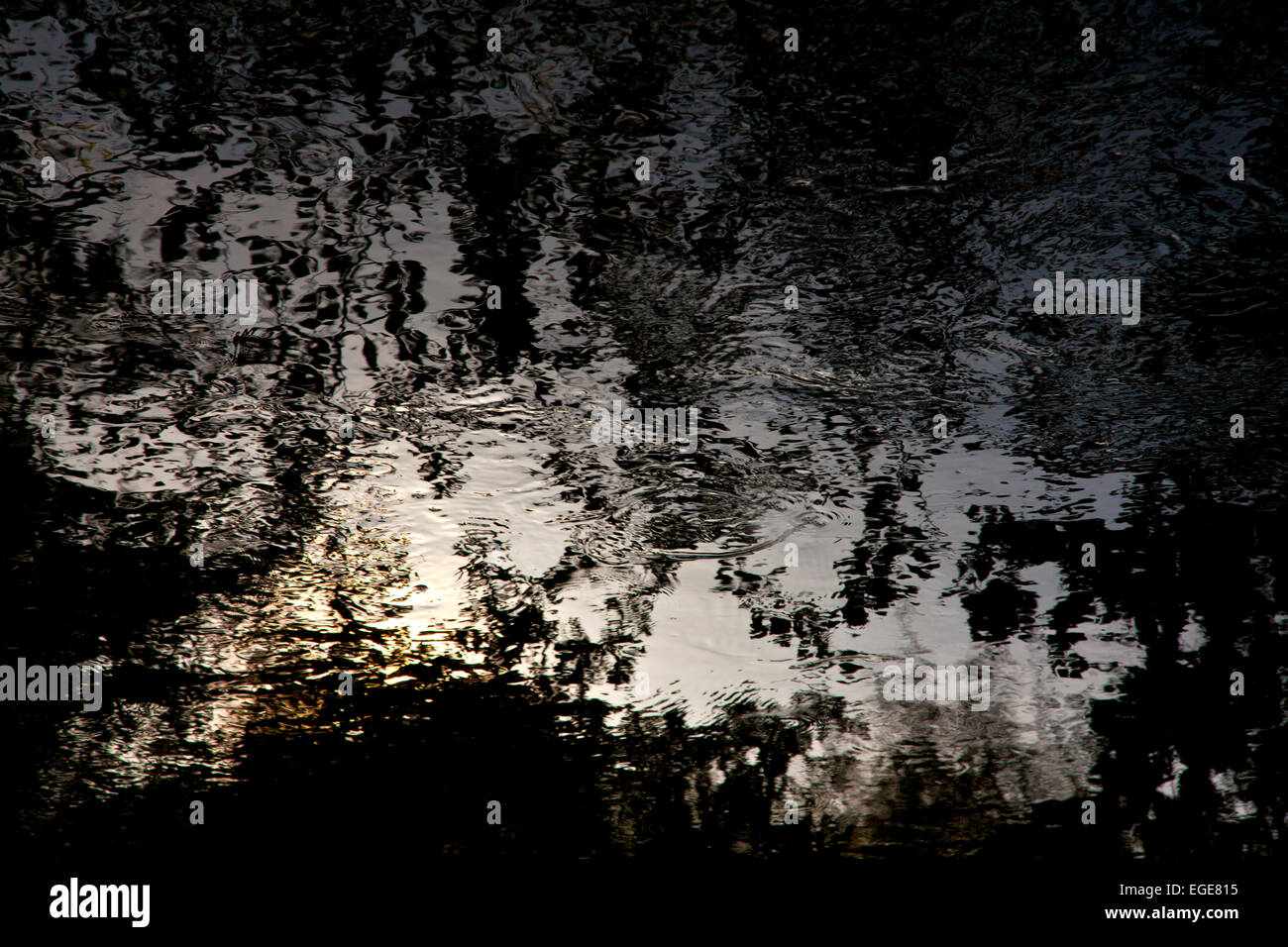 Sky reflecting on waters surface Stock Photo - Alamy