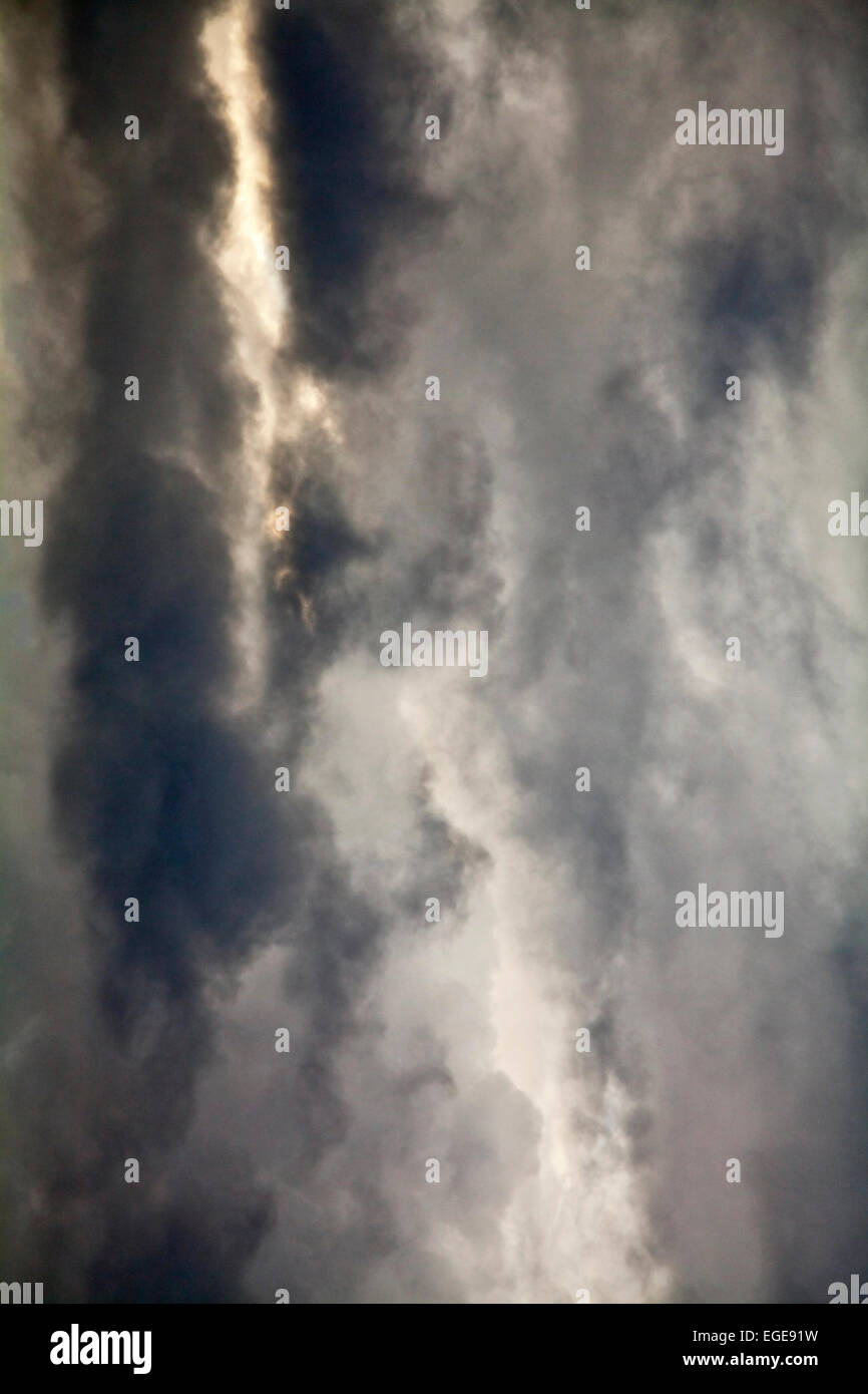 Sun light through clouds Stock Photo - Alamy